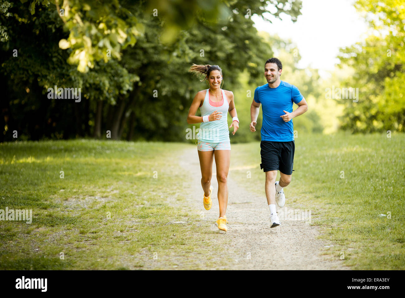 Young couple running Stock Photo - Alamy