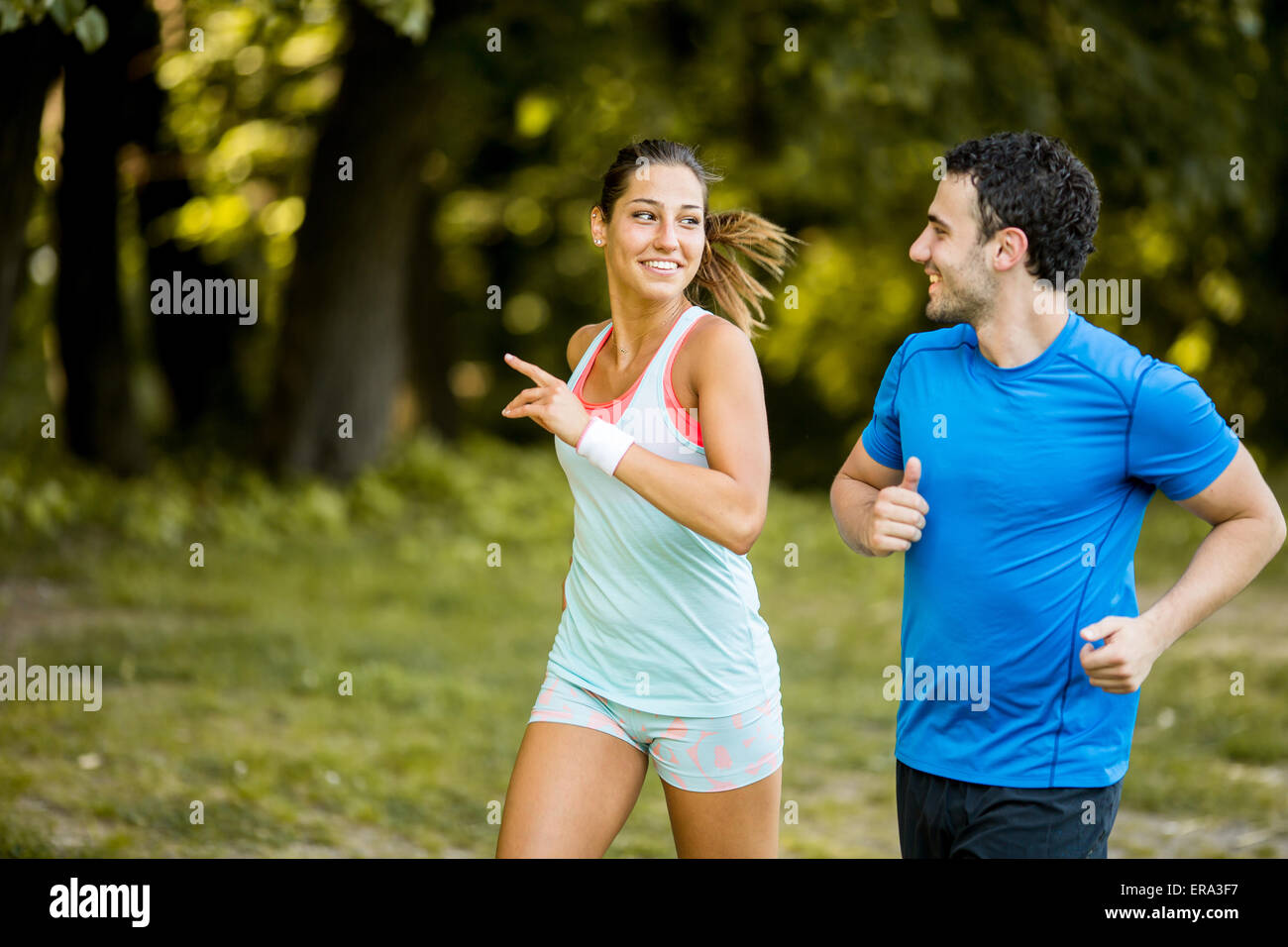 Young couple running Stock Photo - Alamy