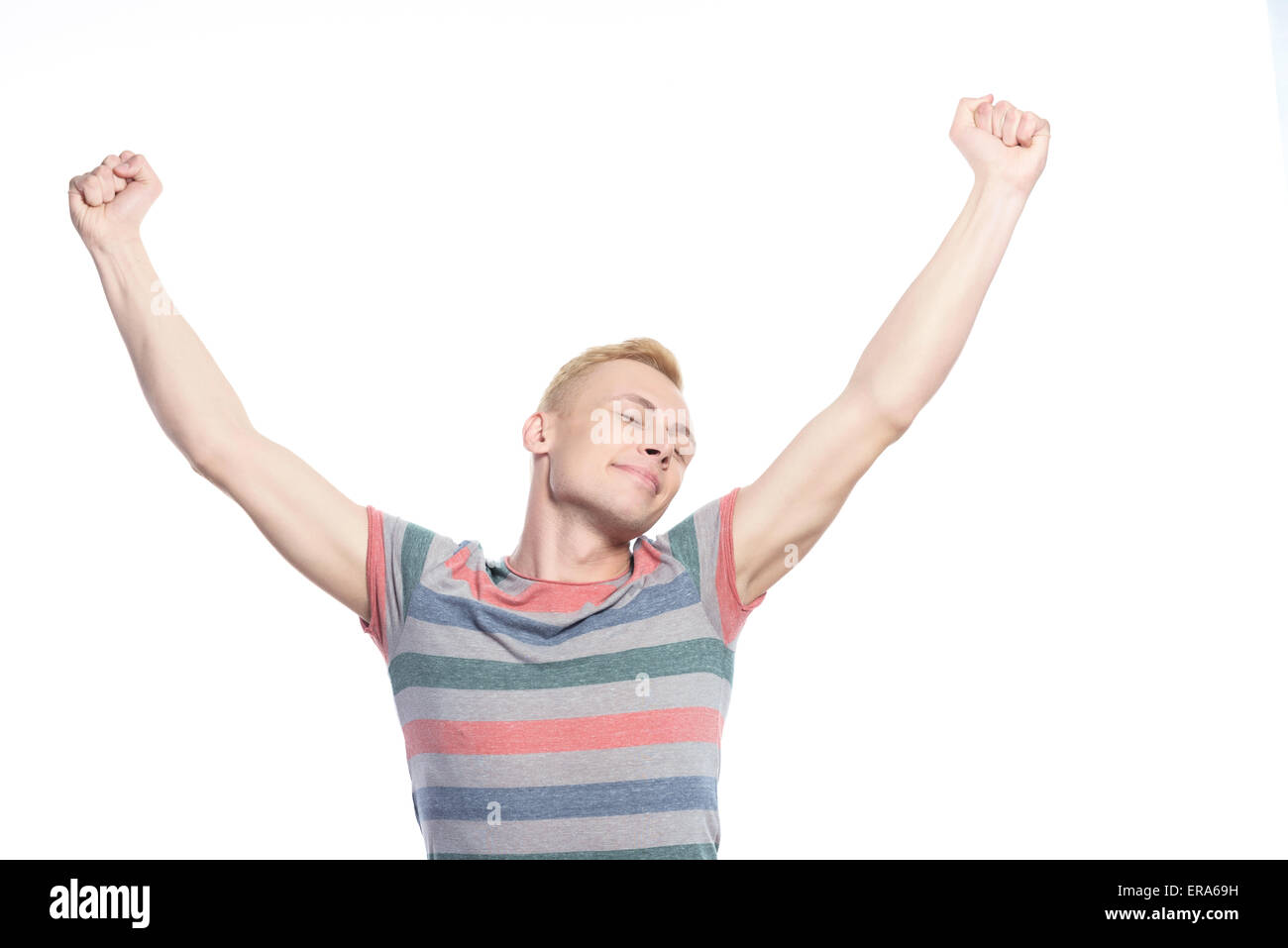 Young handsome man holding hands up Stock Photo - Alamy
