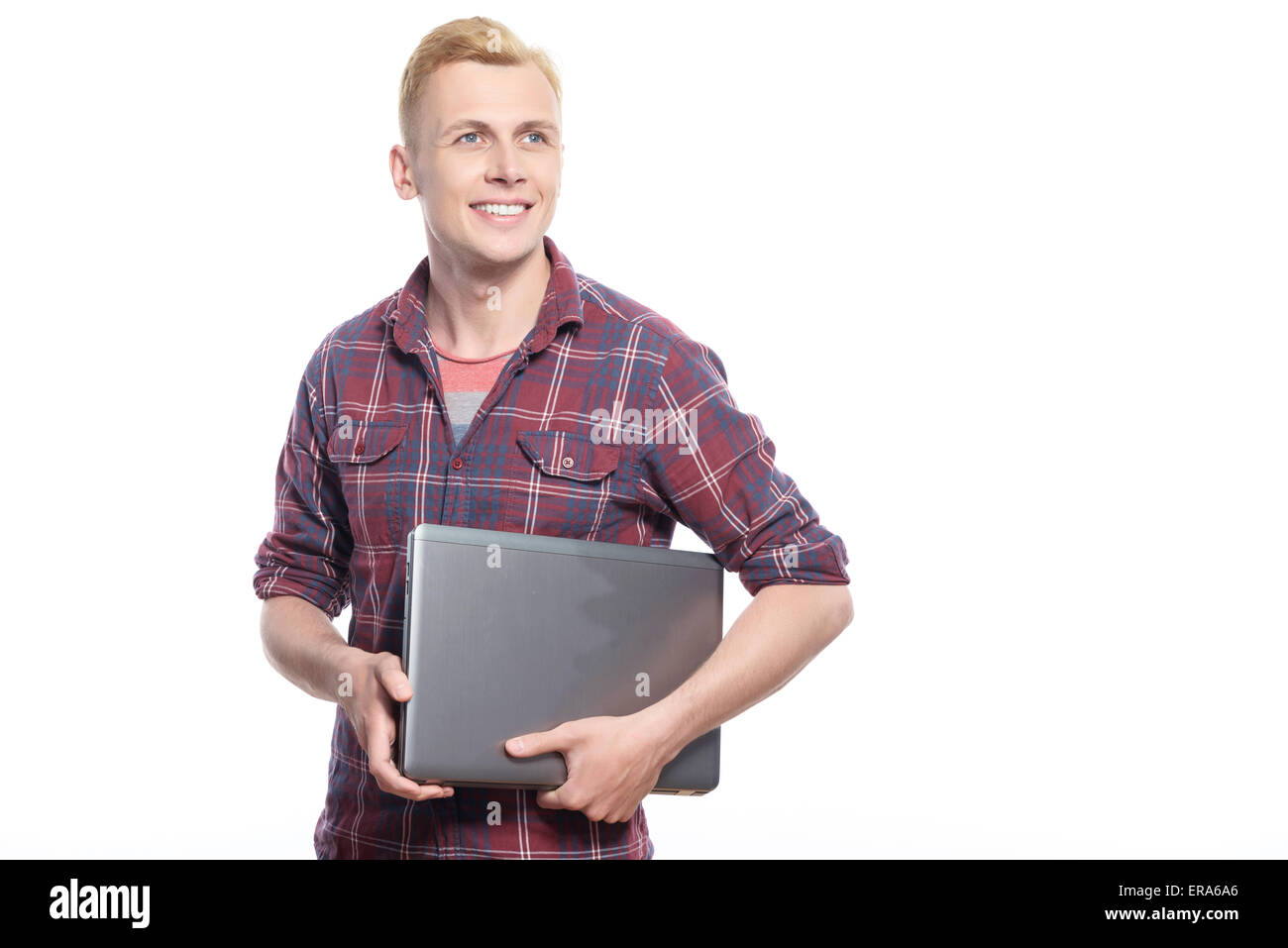 Handsome young man holding laptop Stock Photo - Alamy