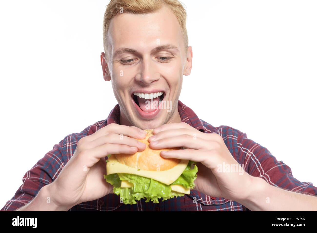 Man taking bite of sandwich Stock Photo - Alamy