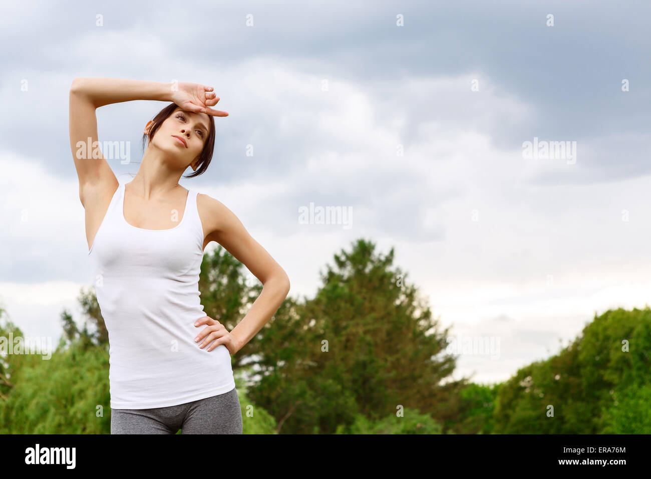 Pleasant tired girl in park Stock Photo - Alamy