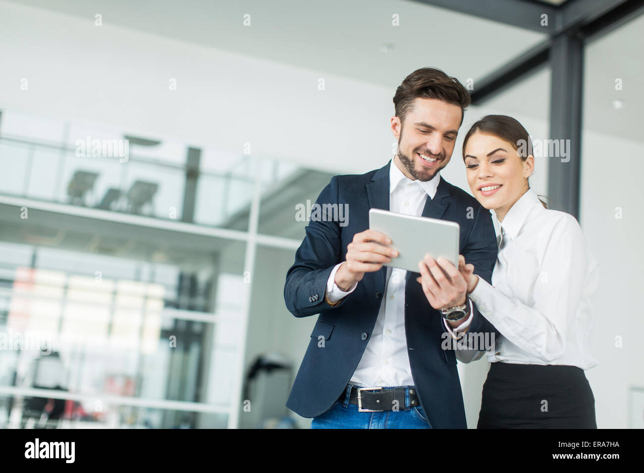 Young people with tablet in the office Stock Photo - Alamy
