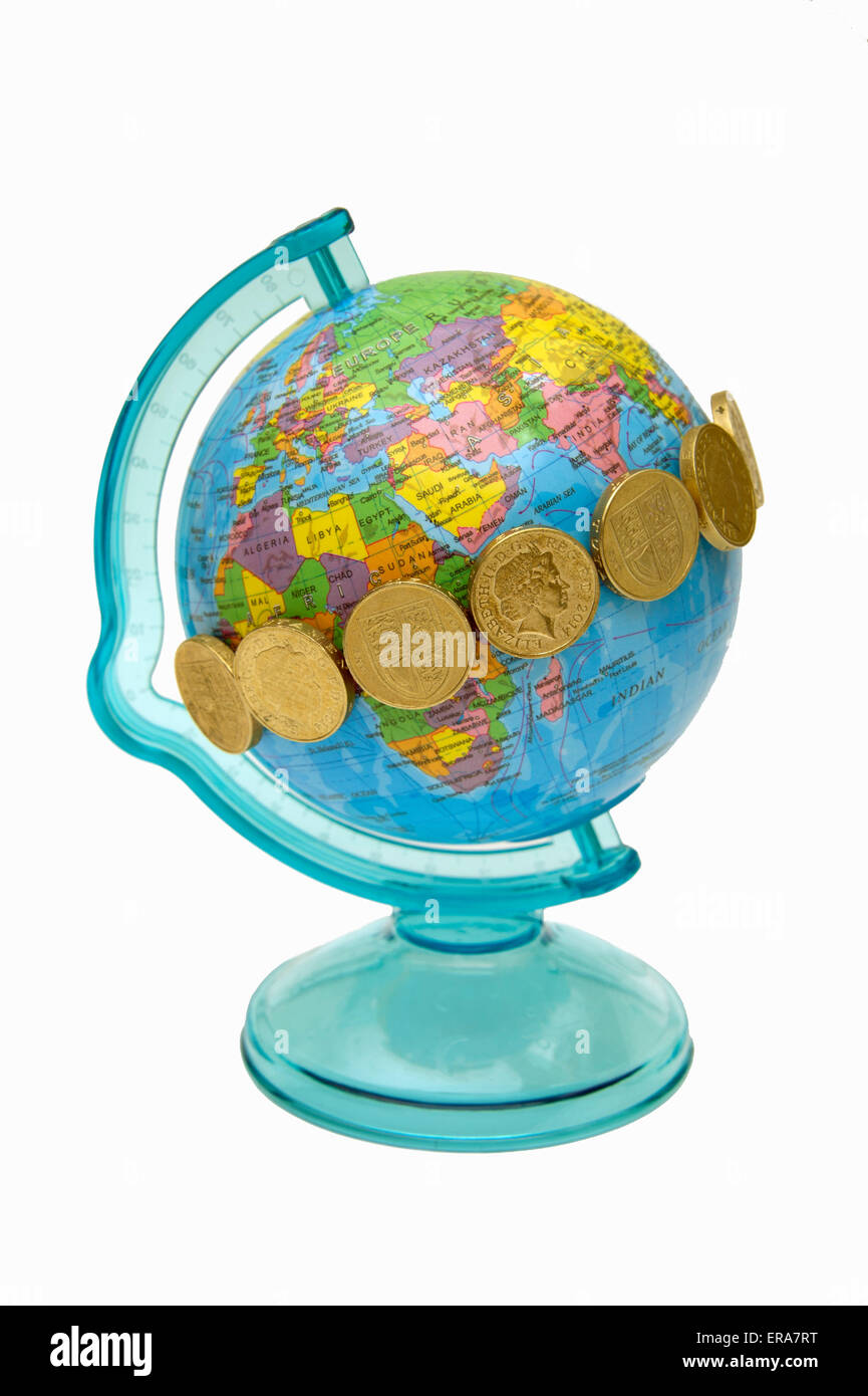 Pound coins arranged around the equator of a toy globe money box Stock ...