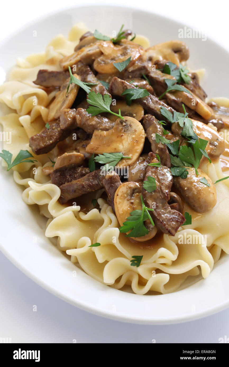 beef stroganoff with pasta, russian cuisine isolated on white ...