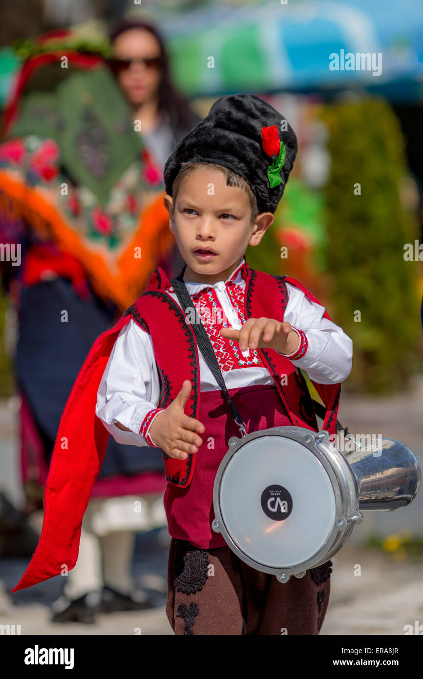 A young male Bulgarian folklore drummer during the traditional folklore ...