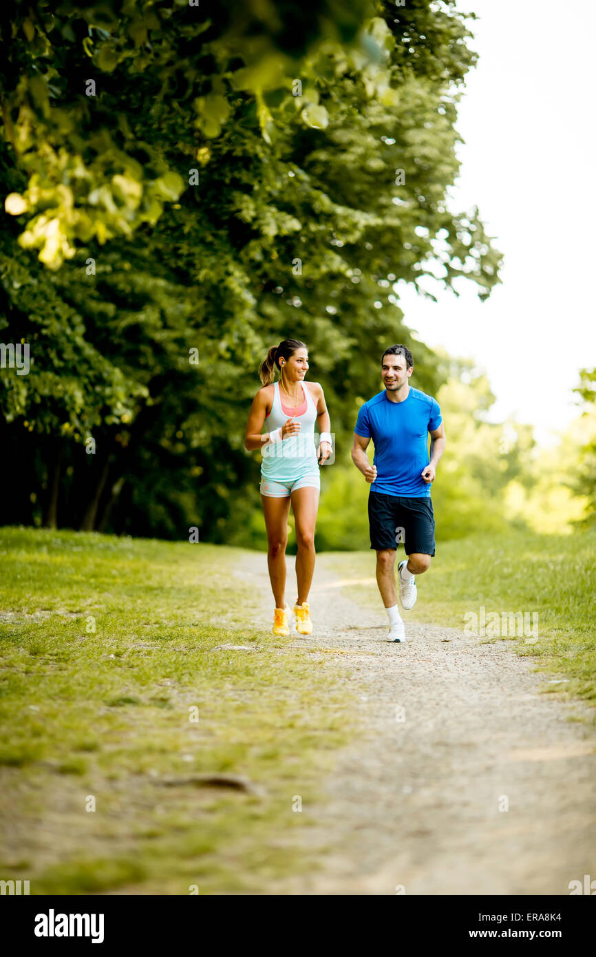 Young couple running Stock Photo - Alamy