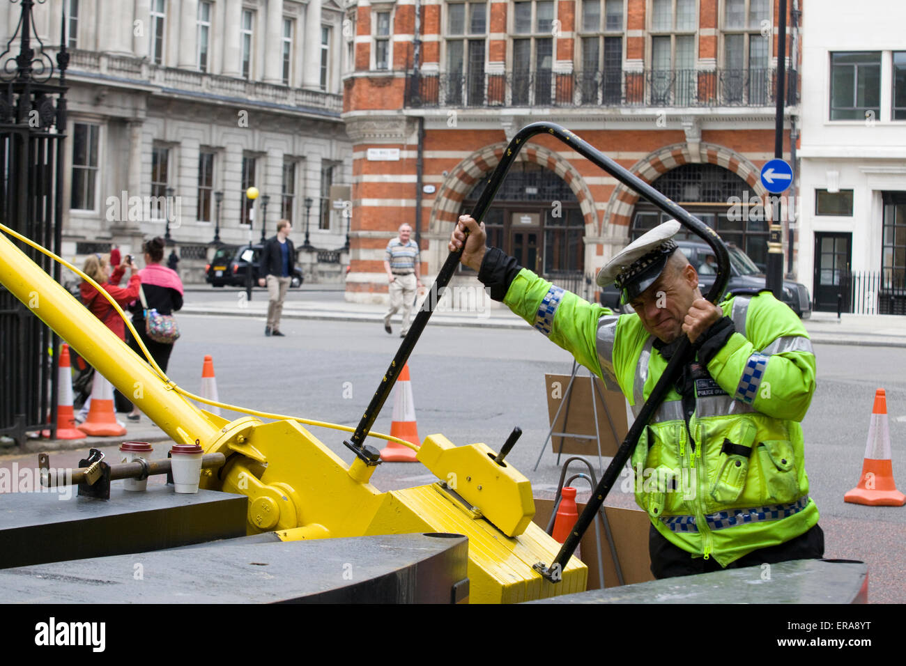 Metropolitan Police Officer pulling a face as he lifts a Lightweight ...