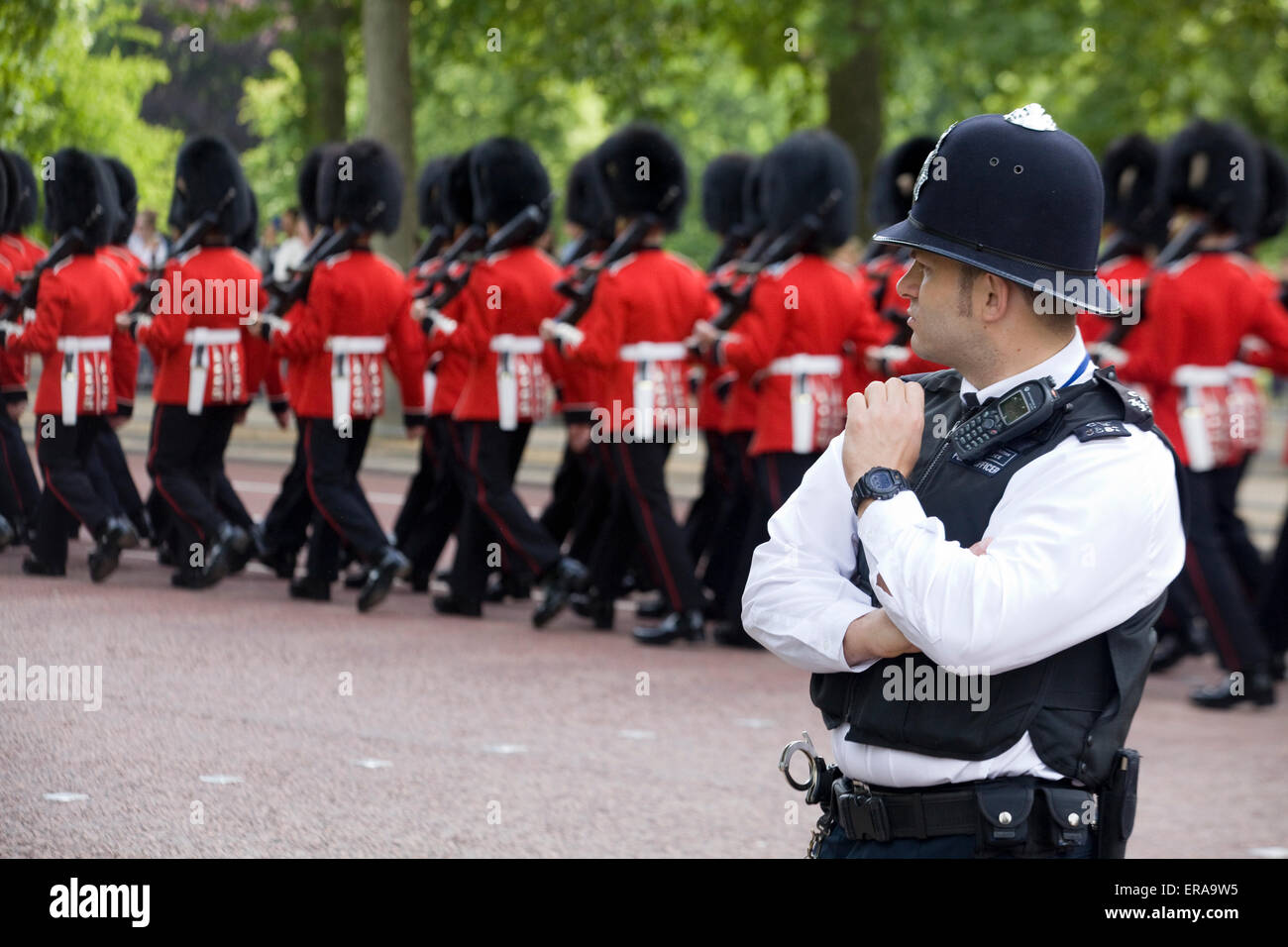 Police officer on crowd control turning to watch the Queens Foot ...