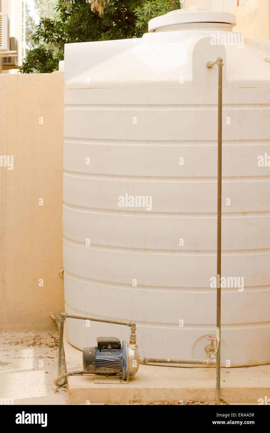 Water pump connected to an external tank closeup Stock Photo - Alamy