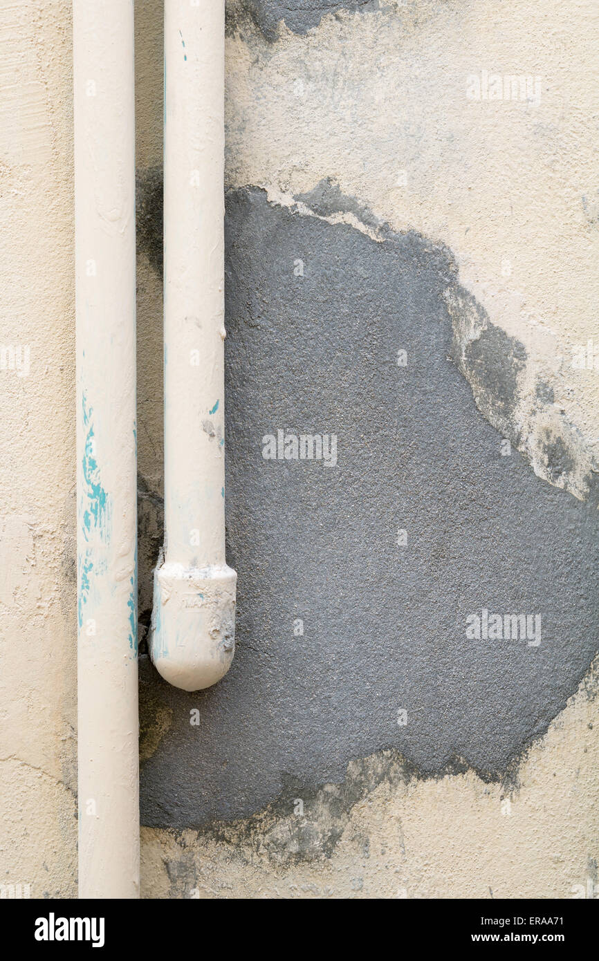 Painted external water pipes closeup Stock Photo - Alamy