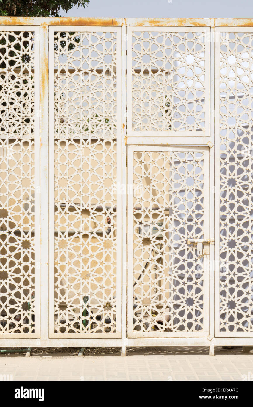 Metallic protective fence around water storage tank worn out paint ...