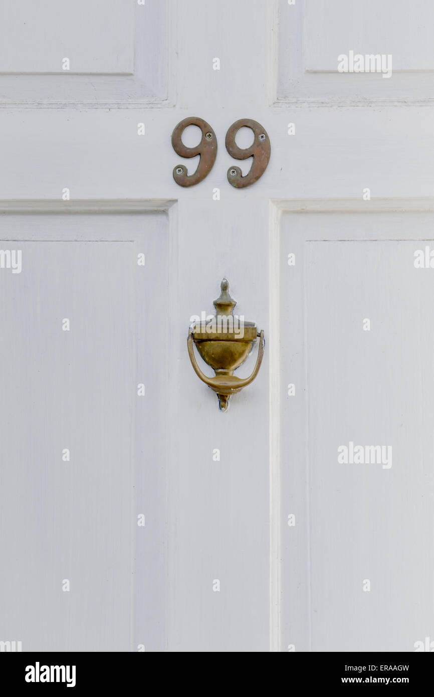 Door number 99 ninety nine vertical image Stock Photo - Alamy