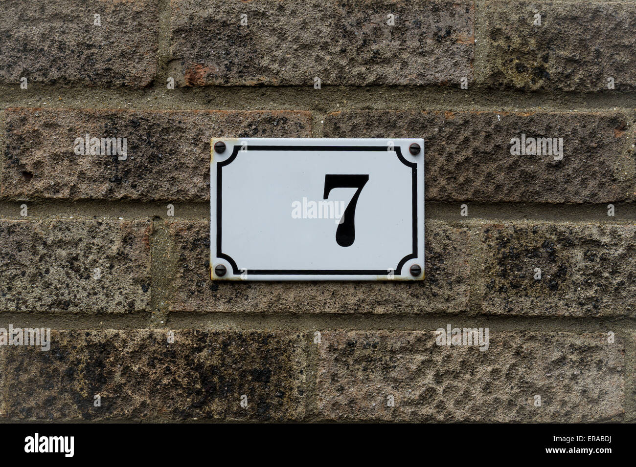 Number 7 seven plated on brick wall conecptual image details Stock ...