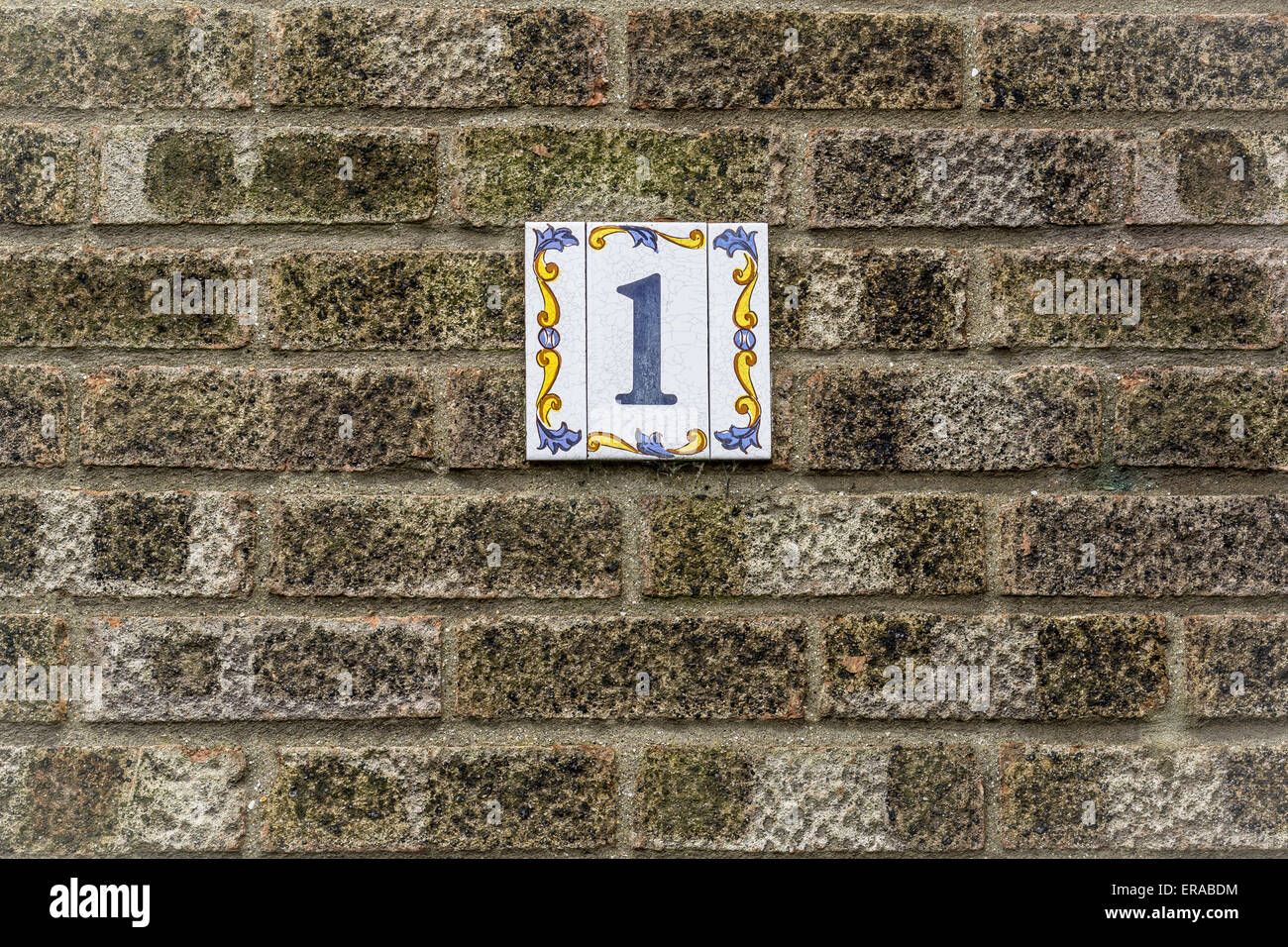 Number 1 one plate on brick wall details Stock Photo - Alamy