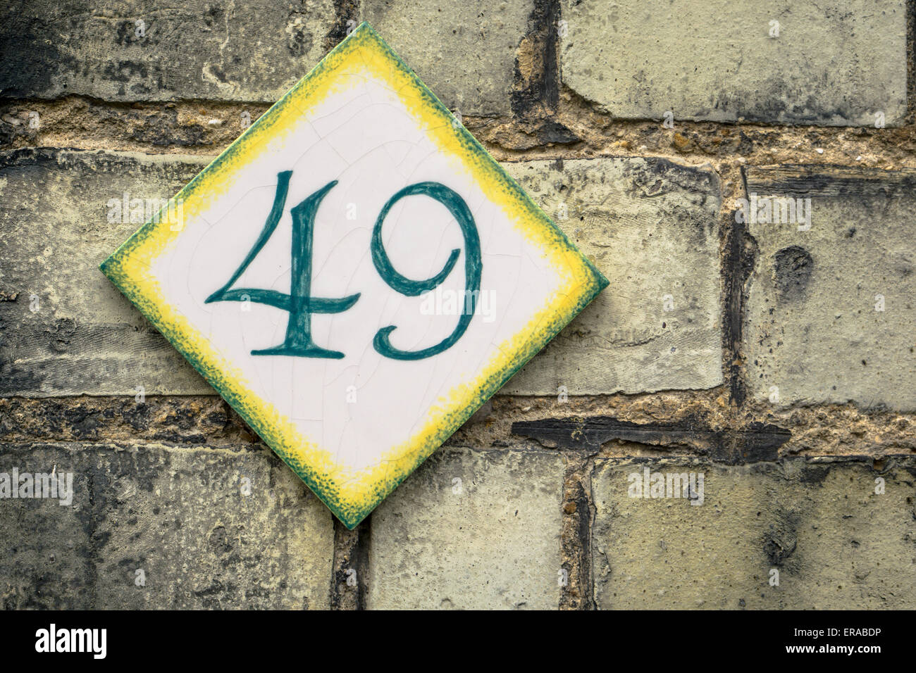 Number 49 on brick wall details Stock Photo - Alamy