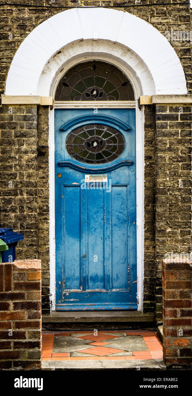 Weathered blue wooden door with stained glass details Stock Photo - Alamy
