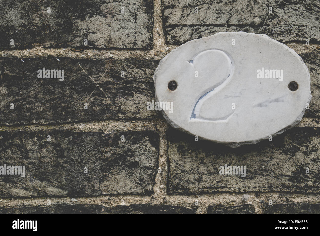 Number 2 two on brick wall vintage look details Stock Photo - Alamy