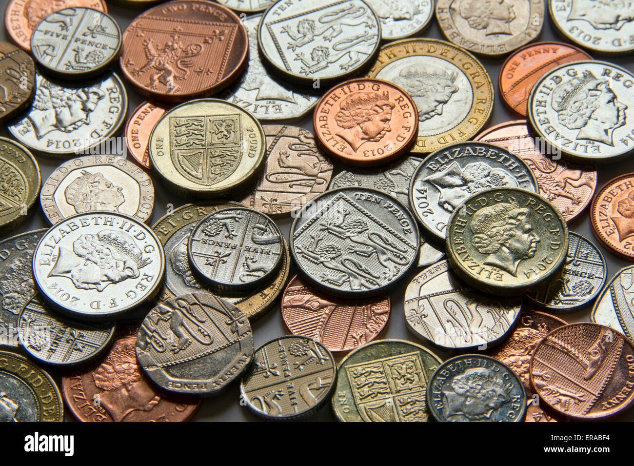 British coinage on a table and in the hand Stock Photo - Alamy