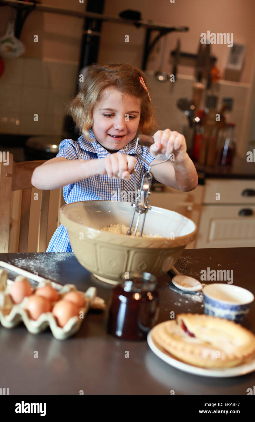 Child mixing flour and eggs hi-res stock photography and images - Alamy