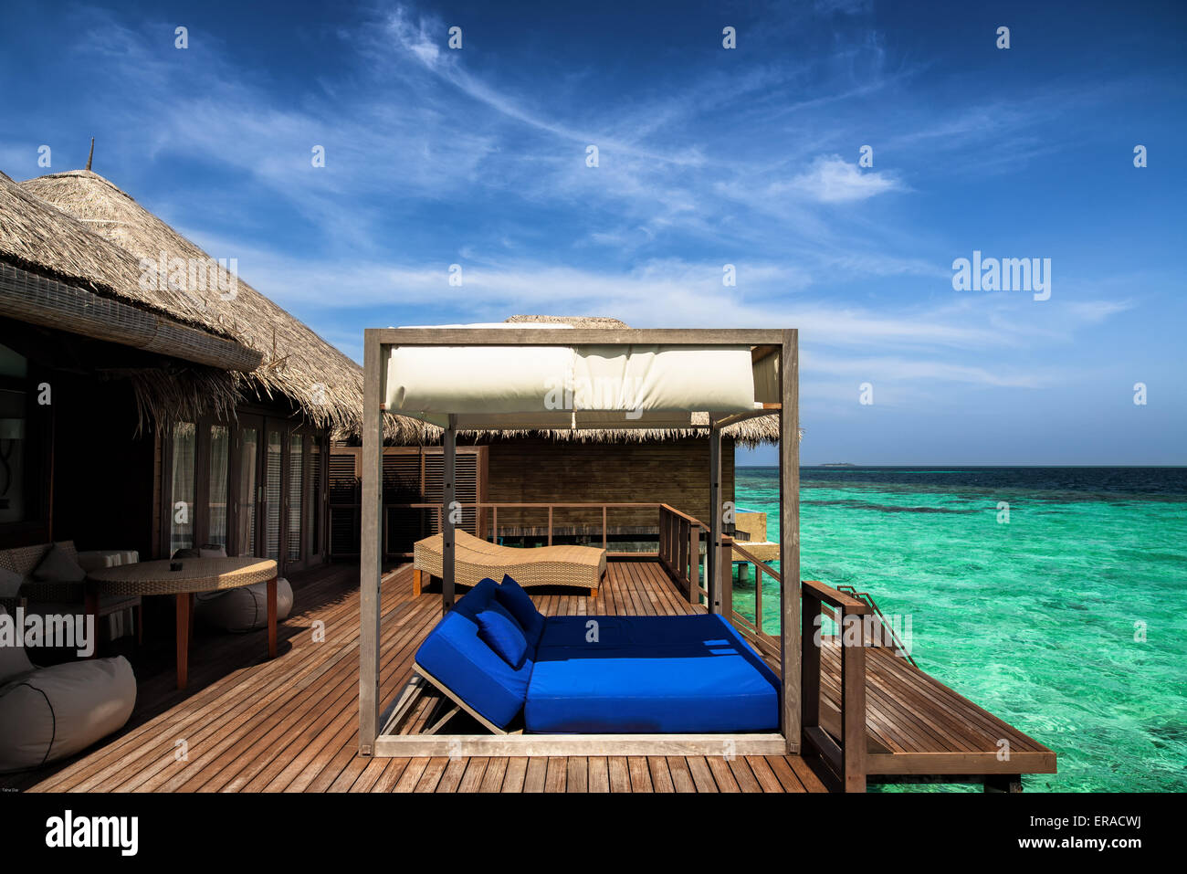 An inviting deck on a water villa in a tropical island Stock Photo - Alamy