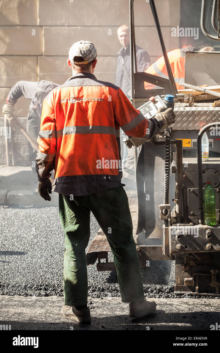 Saint-Petersburg, Russia - May 30, 2015: men at work, urban road under ...