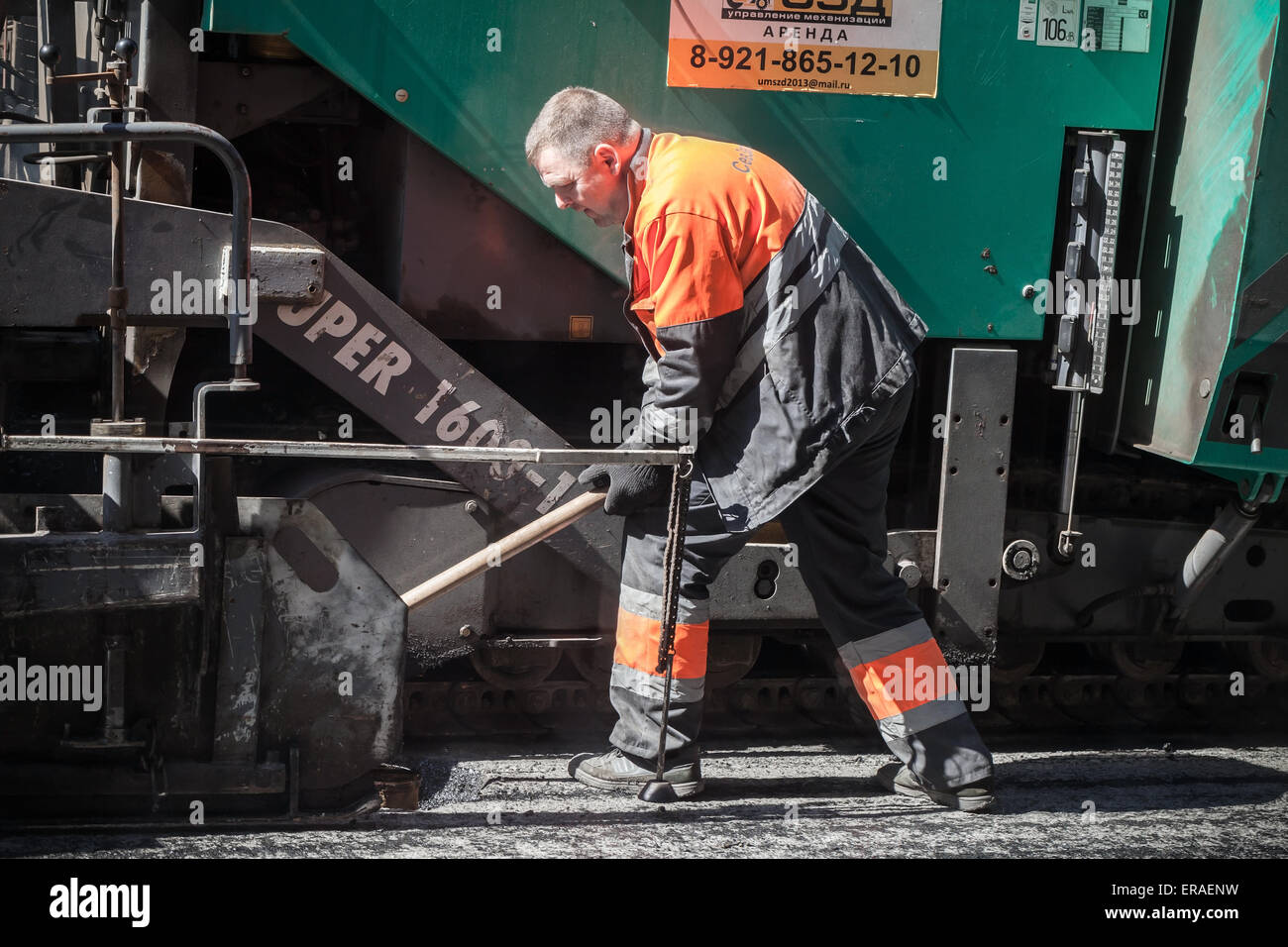 Saint-Petersburg, Russia - May 30, 2015: men at work, urban road under ...