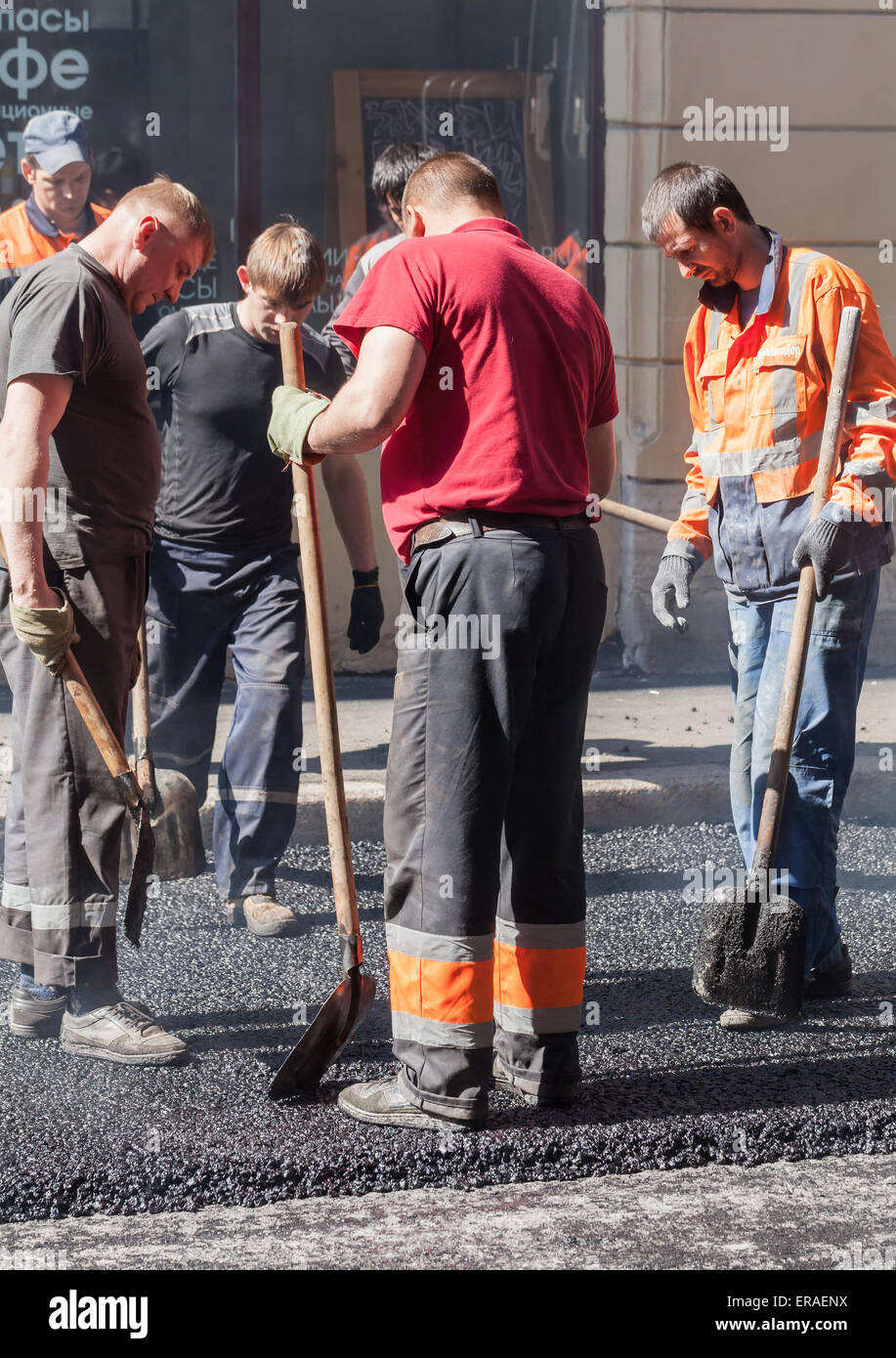 Saint-Petersburg, Russia - May 30, 2015: men at work, urban road under ...