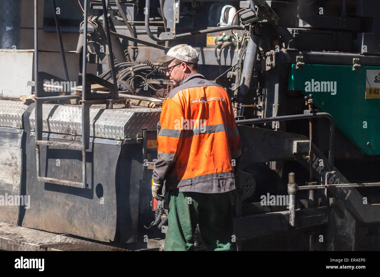 Saint-Petersburg, Russia - May 30, 2015: men at work, urban road under ...