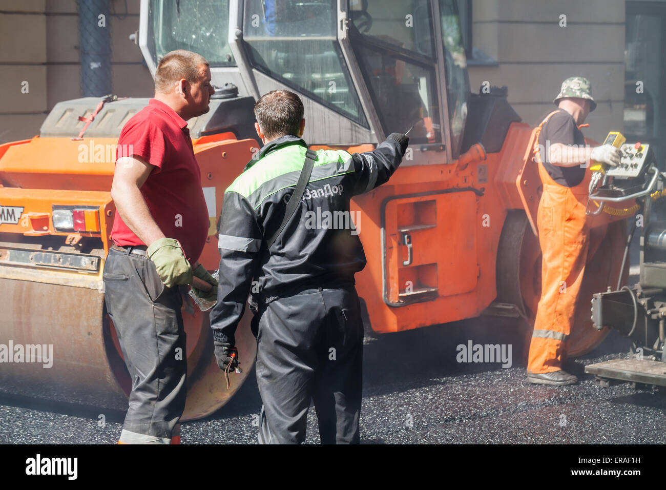 Saint-Petersburg, Russia - May 30, 2015: men at work, urban road under ...