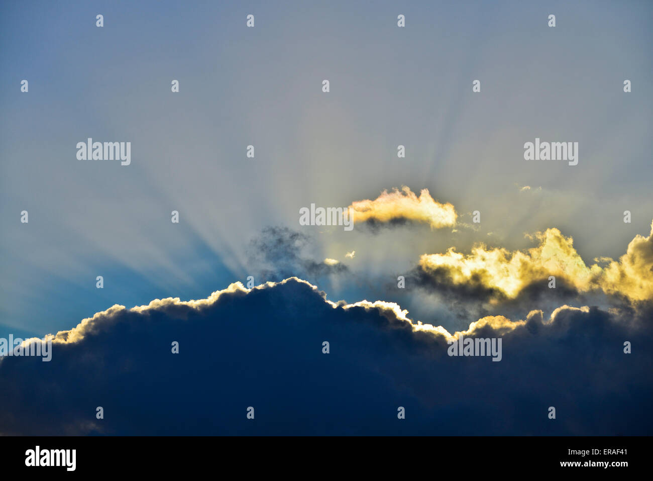 Clouds and sun rays, backlight Stock Photo - Alamy