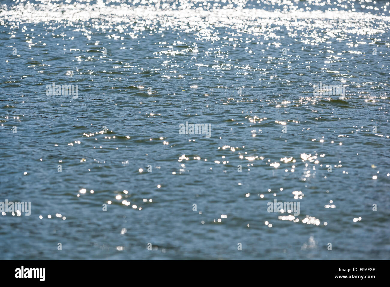 Calm Ocean Water Surface In Morning Reflecting Sun Light Stock Photo ...