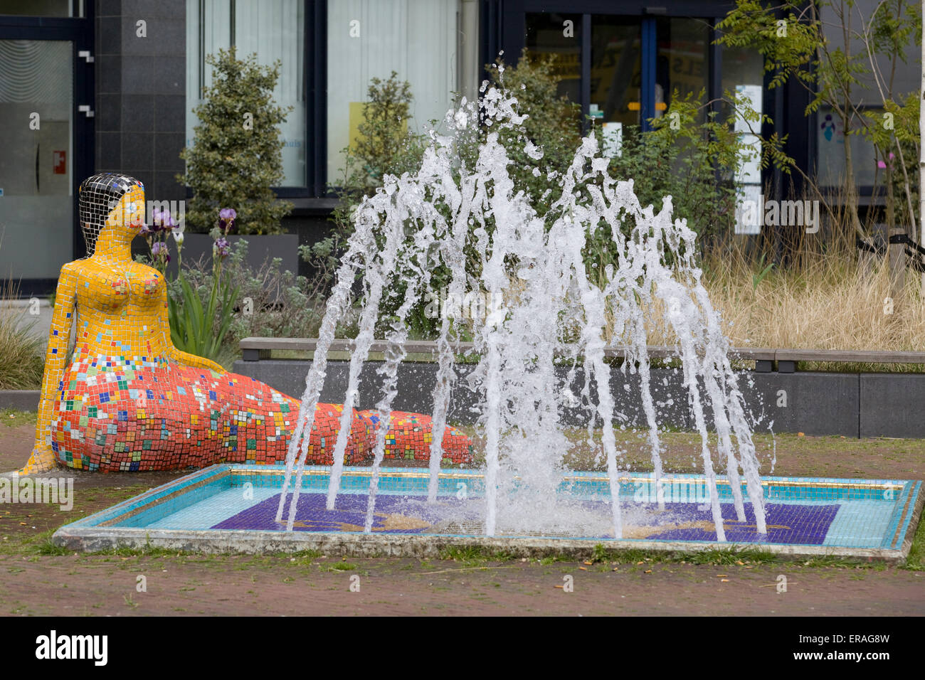 Mermaid Made from Tiles sitting beside an Ornamental Fountain in ...