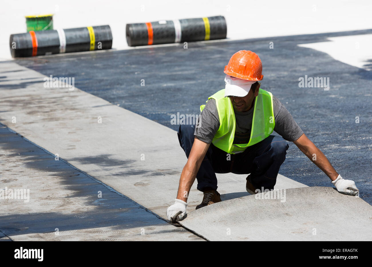 Sofia, Bulgaria - May 21, 2015: Construction workers are waterproofing ...