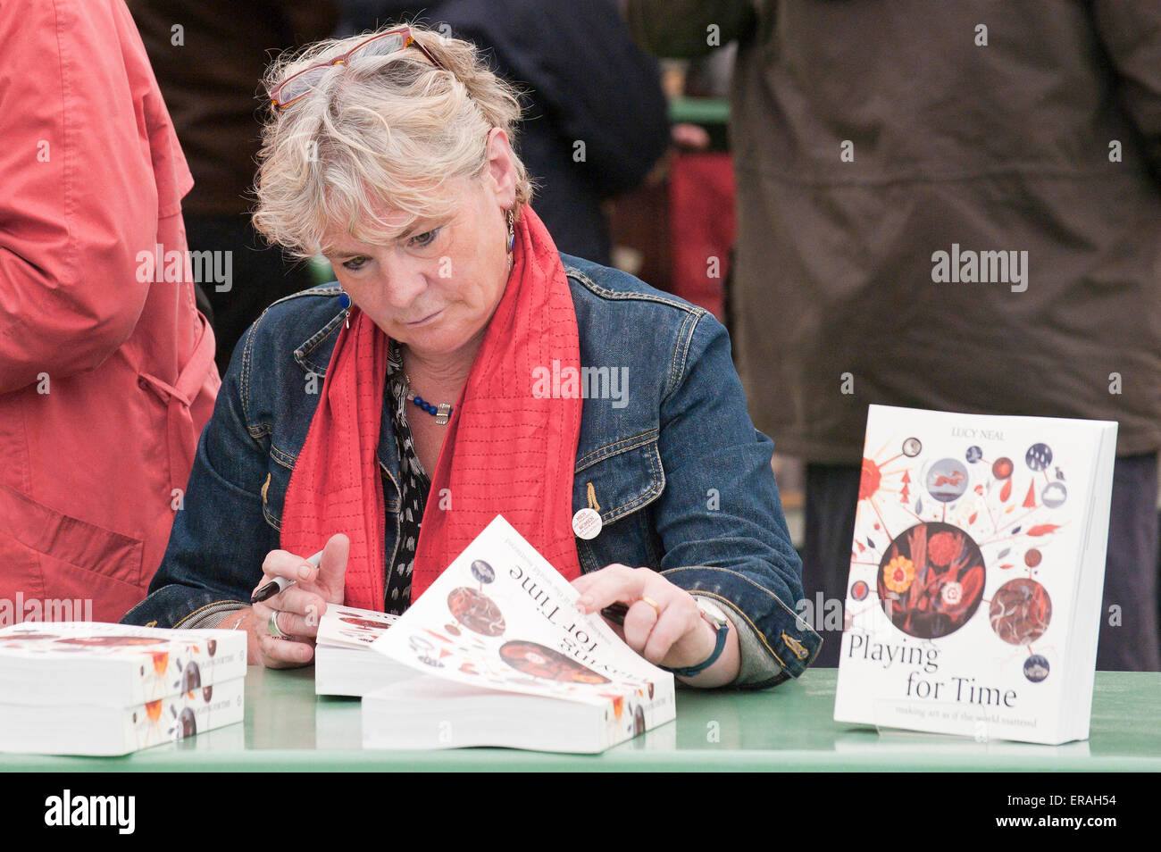 Hay-on-Wye, Powys, UK. 30th May 2015. Lucy Neal signs copies of her ...