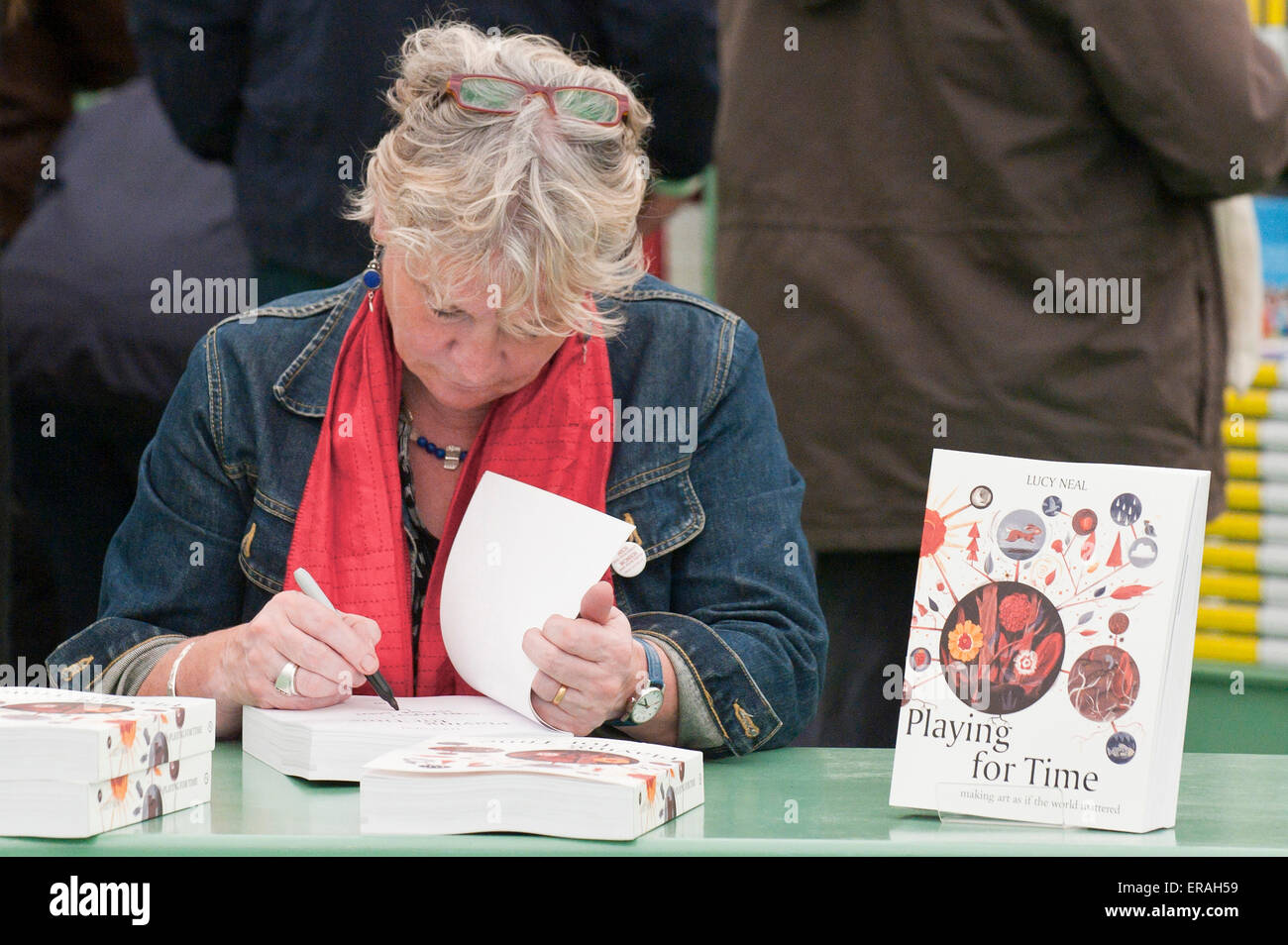 Hay-on-Wye, Powys, UK. 30th May 2015. Lucy Neal signs copies of her ...