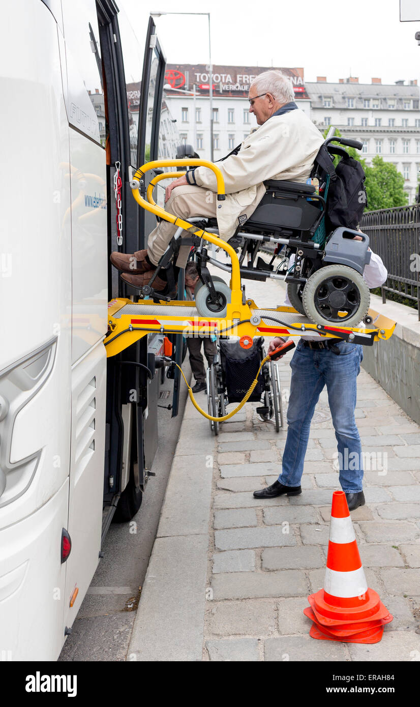 Vienna, Austria - May 1, 2015: A bus driver helps physically disabled ...