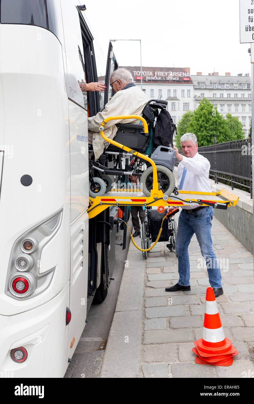 Vienna, Austria - May 1, 2015: A bus driver helps physically disabled ...