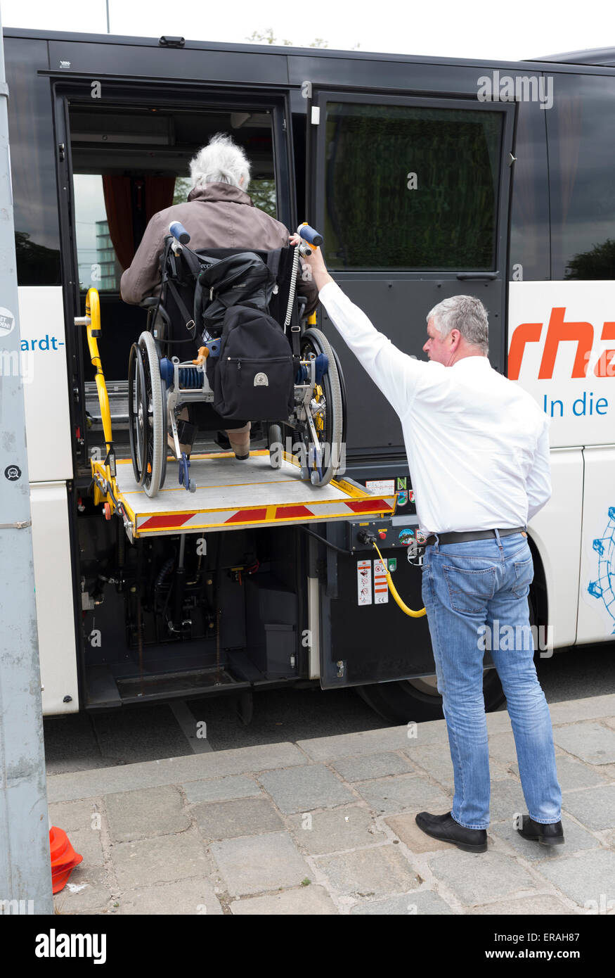 Vienna, Austria - May 1, 2015: A bus driver helps physically disabled ...