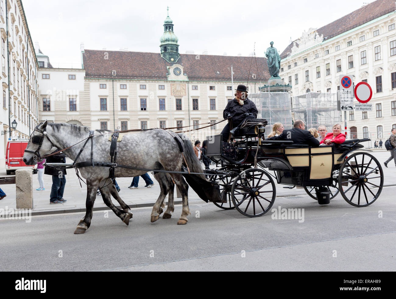 Vienna, Austria.- May 1, 2015: Tourists are traveling with a horse ...