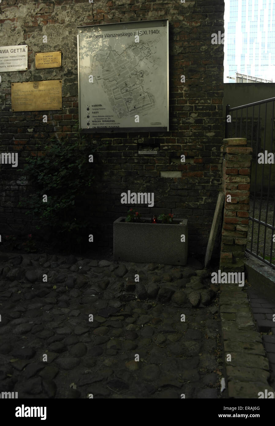 Metal memorial plaques next to large map showing ghetto as it was in ...