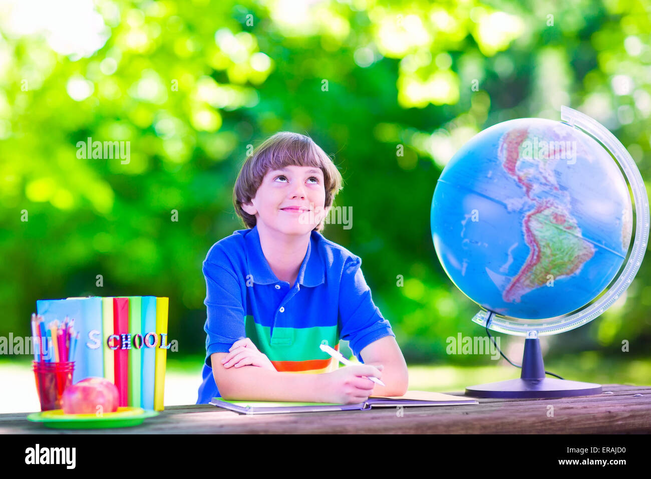 Child in school yard. Kids study. Happy laughing teenager student boy ...