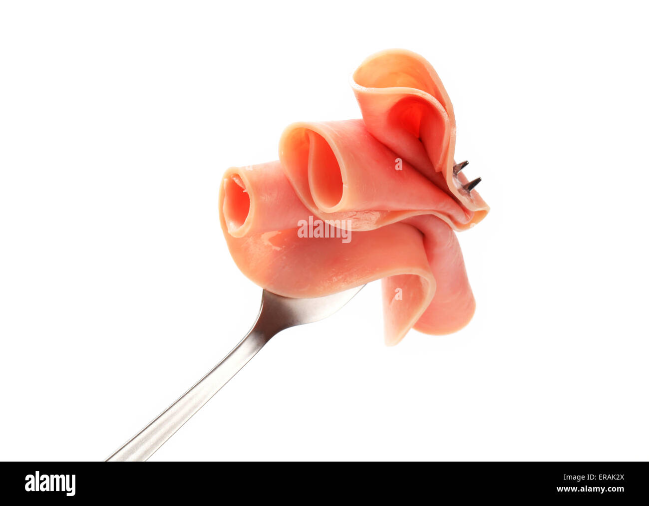 Slice of ham on a fork Stock Photo - Alamy