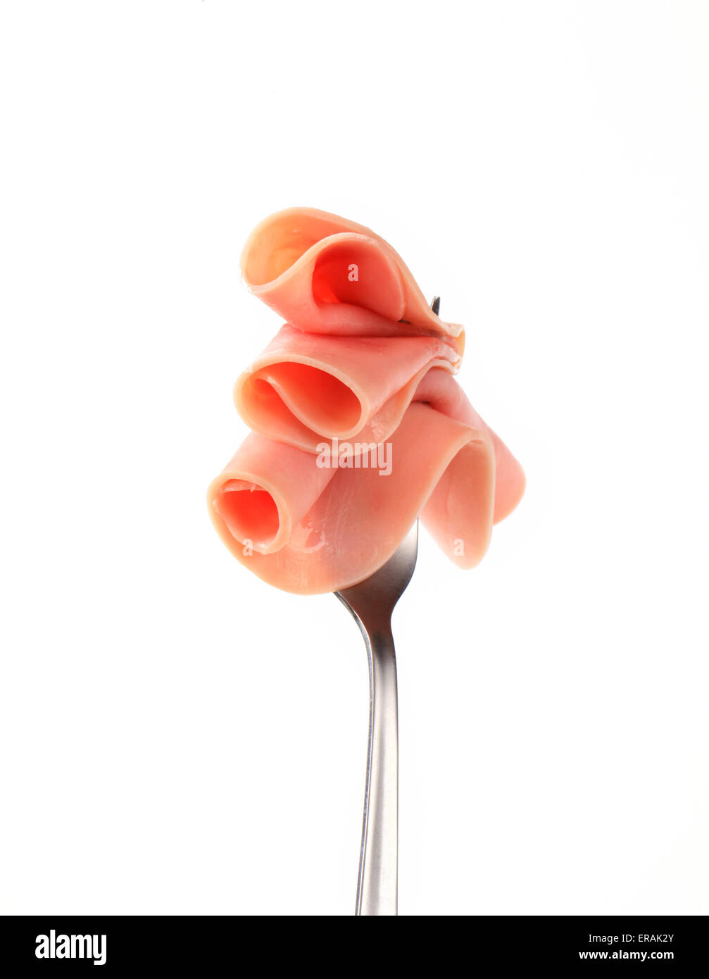 Slice of ham on a fork Stock Photo - Alamy