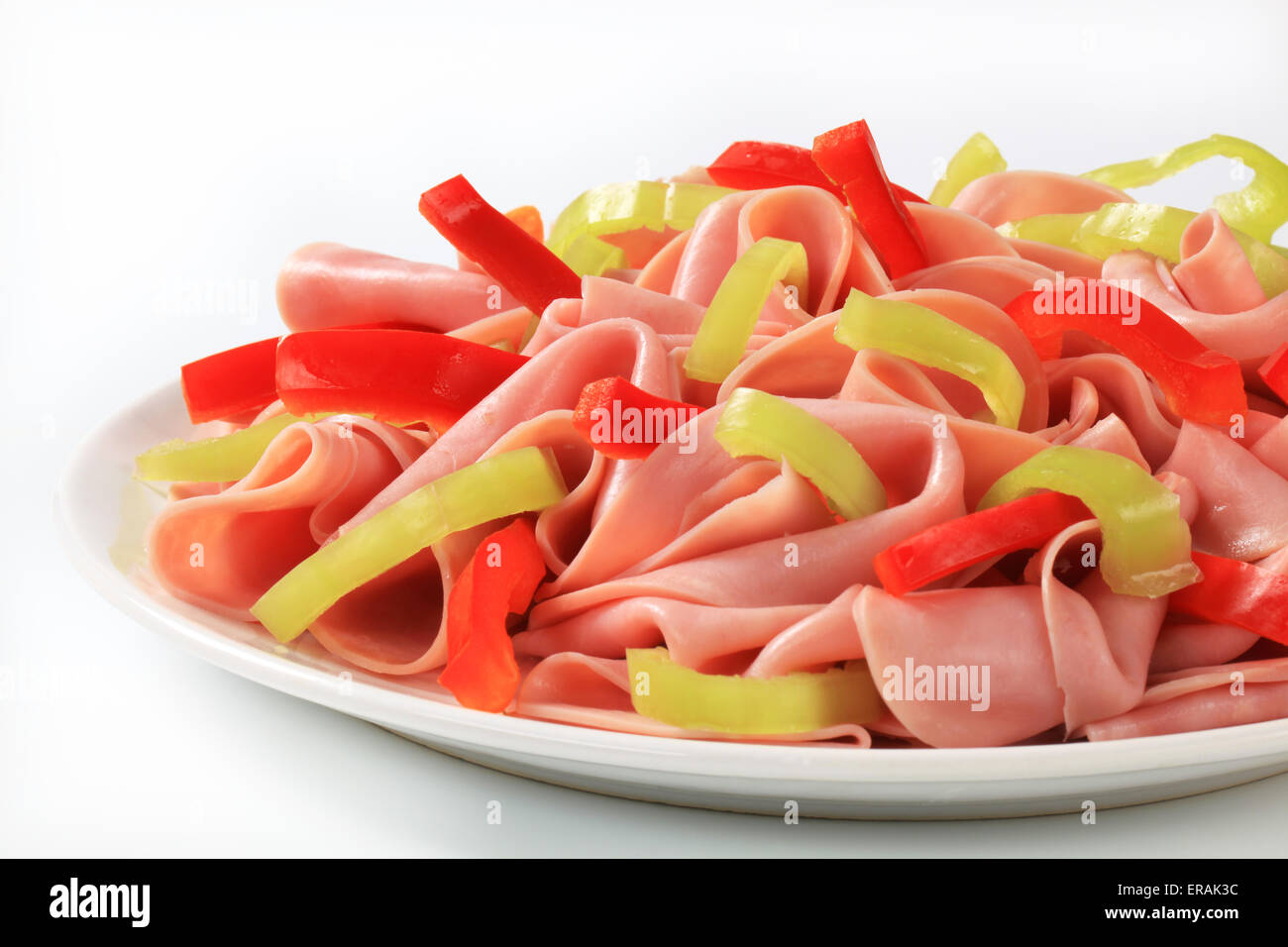Thinly sliced ham and strips of fresh pepper Stock Photo - Alamy
