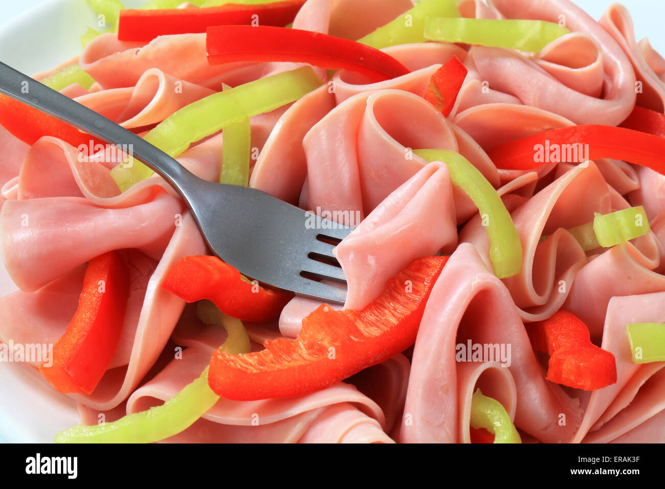 Thinly sliced ham and strips of fresh pepper Stock Photo - Alamy