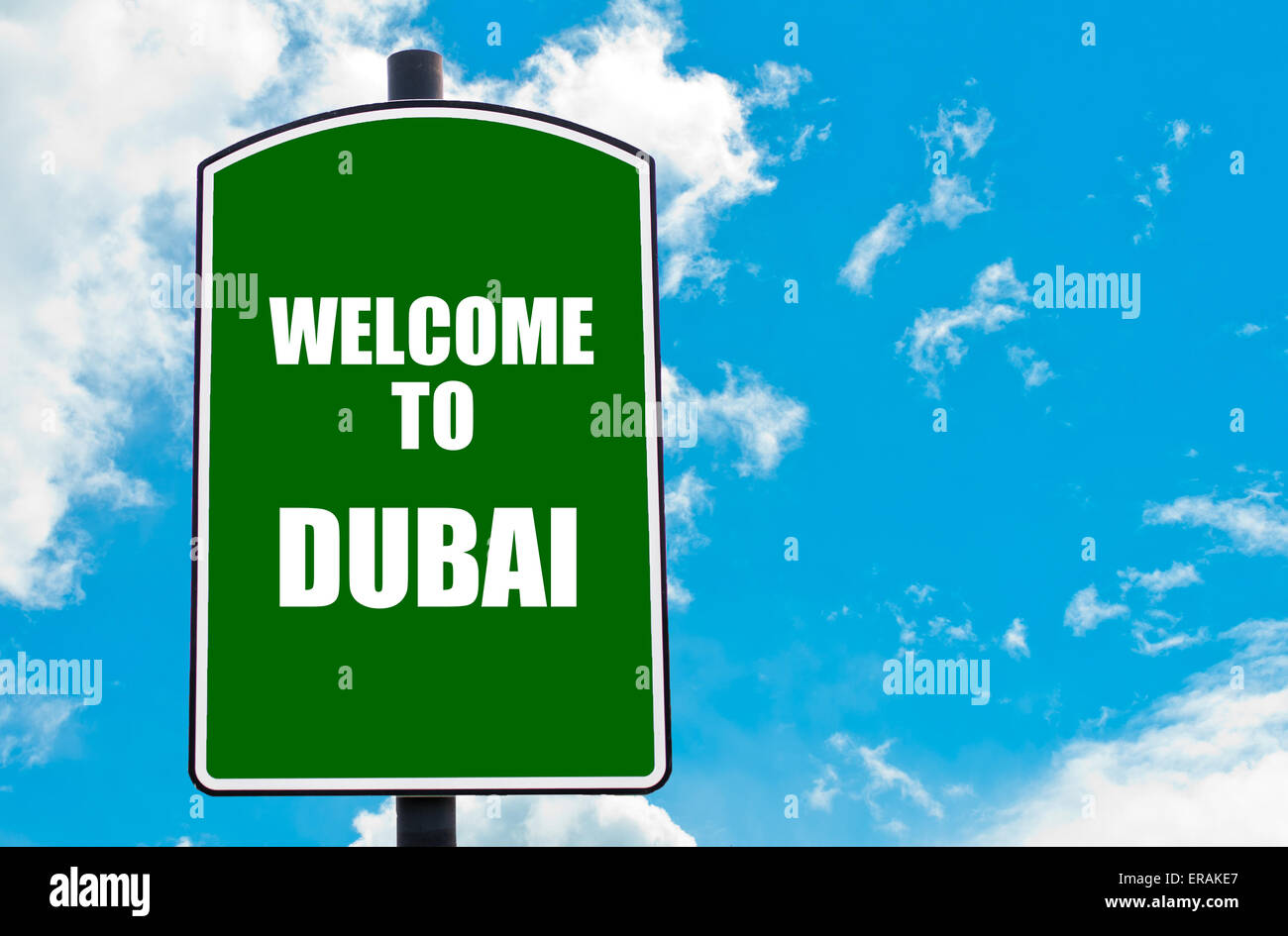 Green road sign with greeting message WELCOME TO DUBAI isolated over ...