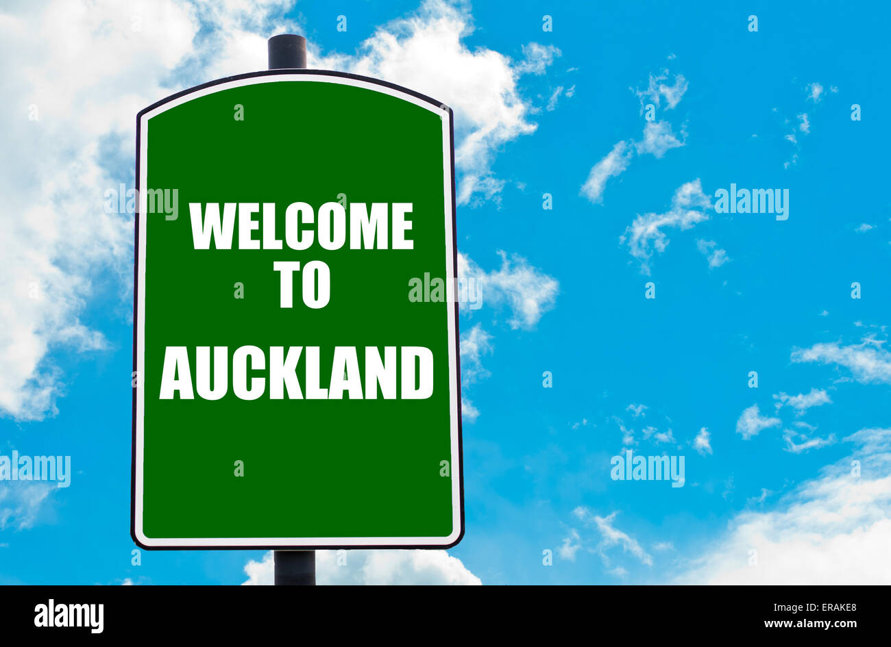 Green road sign with greeting message WELCOME TO AUCKLAND isolated over ...