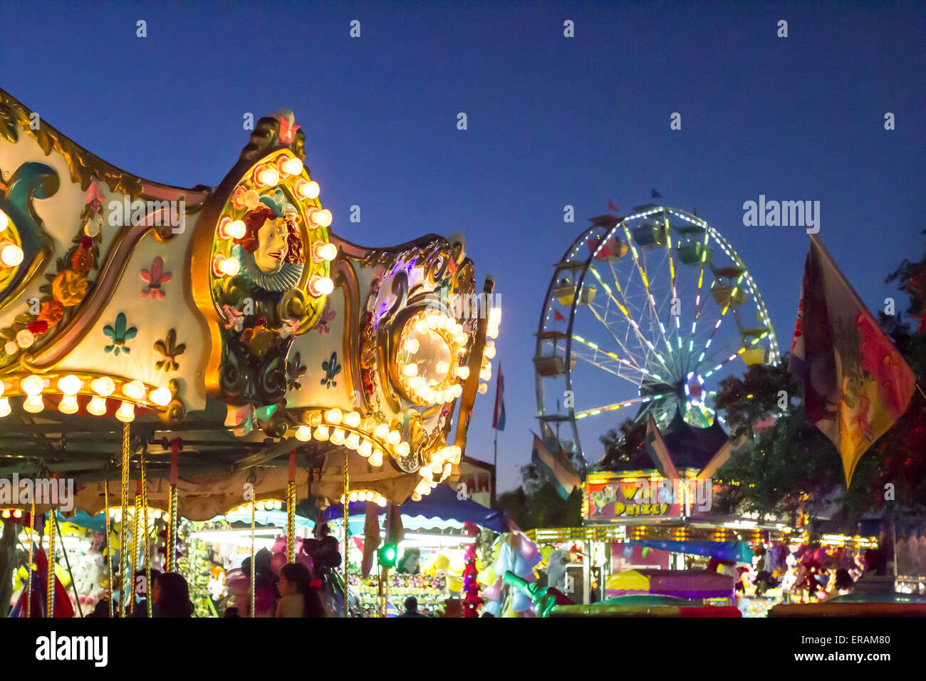 Carrousel or merry-go-round and ferris wheel at Cornyval fair in ...