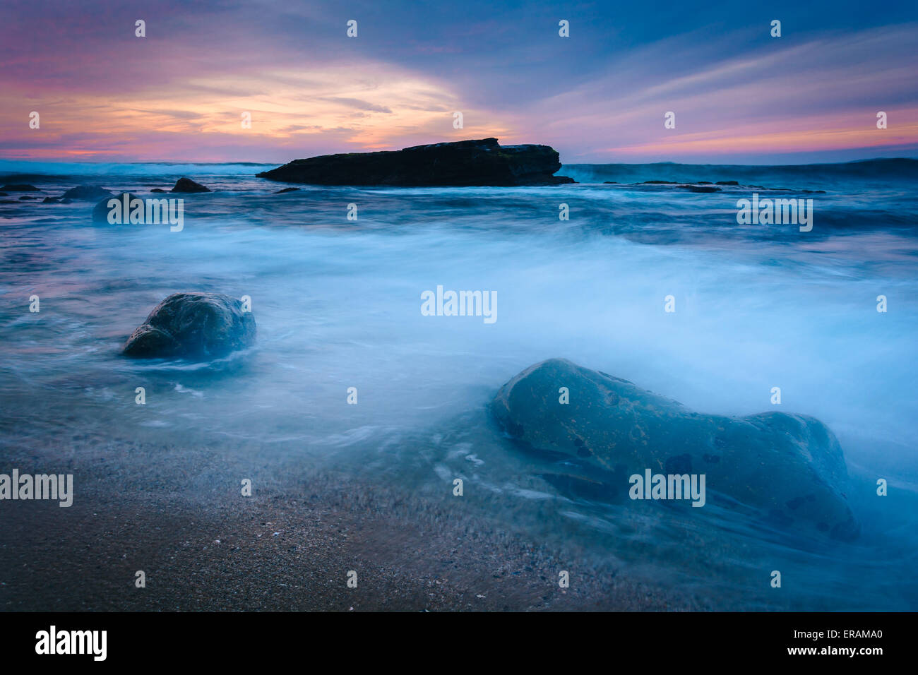 Waves and rocks in the Pacific Ocean at sunset, seen at Shell Beach, in ...